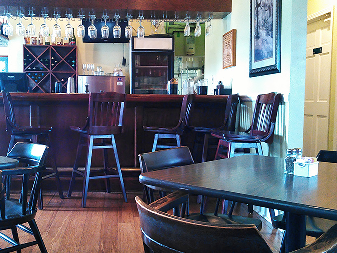 Dark wood chairs and intimate tables create conversation-friendly spaces where meals turn into memories.