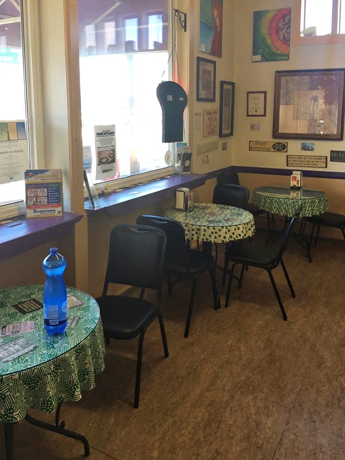 Small tables, green cloths, and walls covered in bakery wisdom create the perfect spot to enjoy your haul.