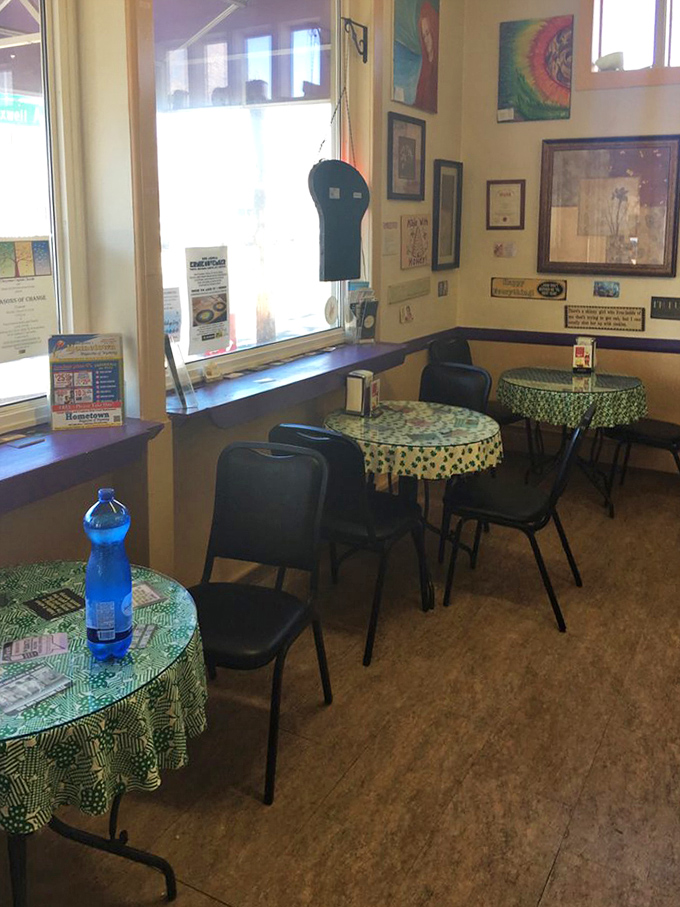 Small tables, green cloths, and walls covered in bakery wisdom create the perfect spot to enjoy your haul.