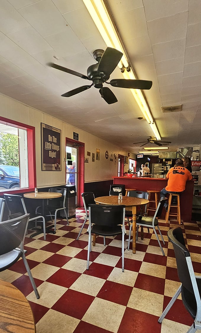 Simple wooden tables, no-nonsense chairs, and ceiling fans that have witnessed countless "first bite" moments. Comfort trumps pretension every time.