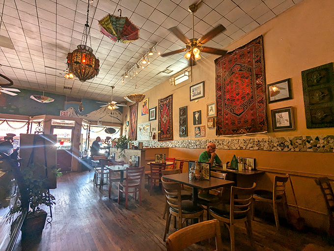 Colorful umbrellas hanging from the ceiling create an unexpected whimsy in this section of the cafe. Even cowboys appreciate a touch of the unexpected.