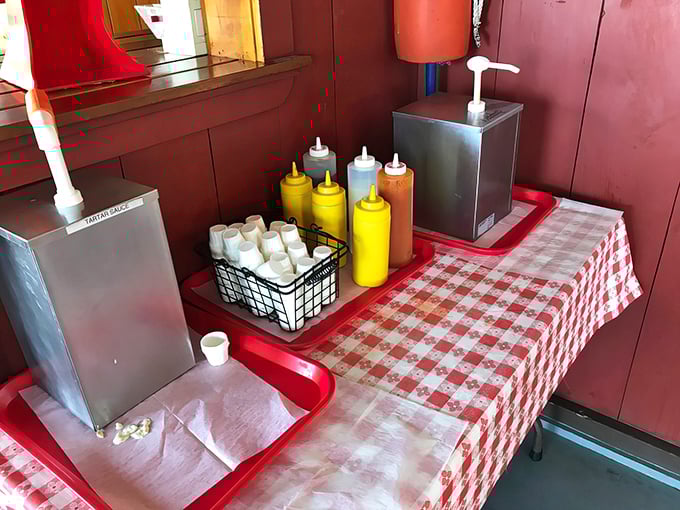 The condiment station&mdash;where customization meets simplicity. Those squeeze bottles hold the power to elevate your seafood experience to personal perfection.