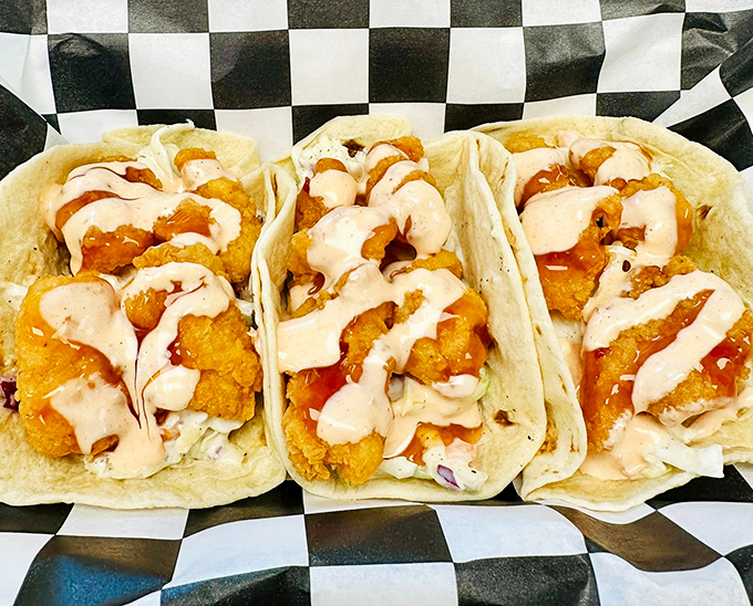 These aren't your average tacos &ndash; crispy shrimp, drizzled sauce, and fresh toppings create handheld happiness that defies categorization.
