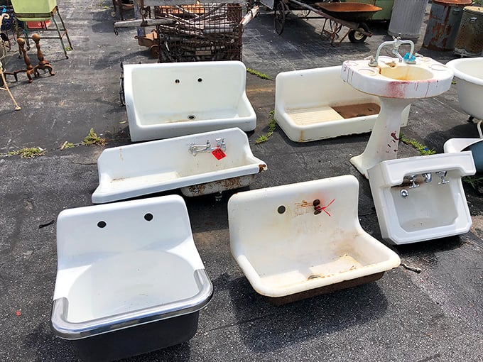 Cast iron sinks waiting for their second act – these beauties have seen more Sunday dinners than we've had hot meals.
