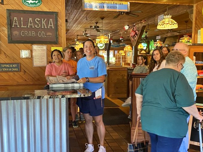 The staff stands ready to guide you through your seafood adventure. Their smiles suggest they know exactly what deliciousness awaits you.