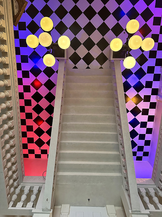 These psychedelic stairs lead to wonderland, complete with checkerboard walls and glowing orbs. Alice would approve of this trippy architectural masterpiece.