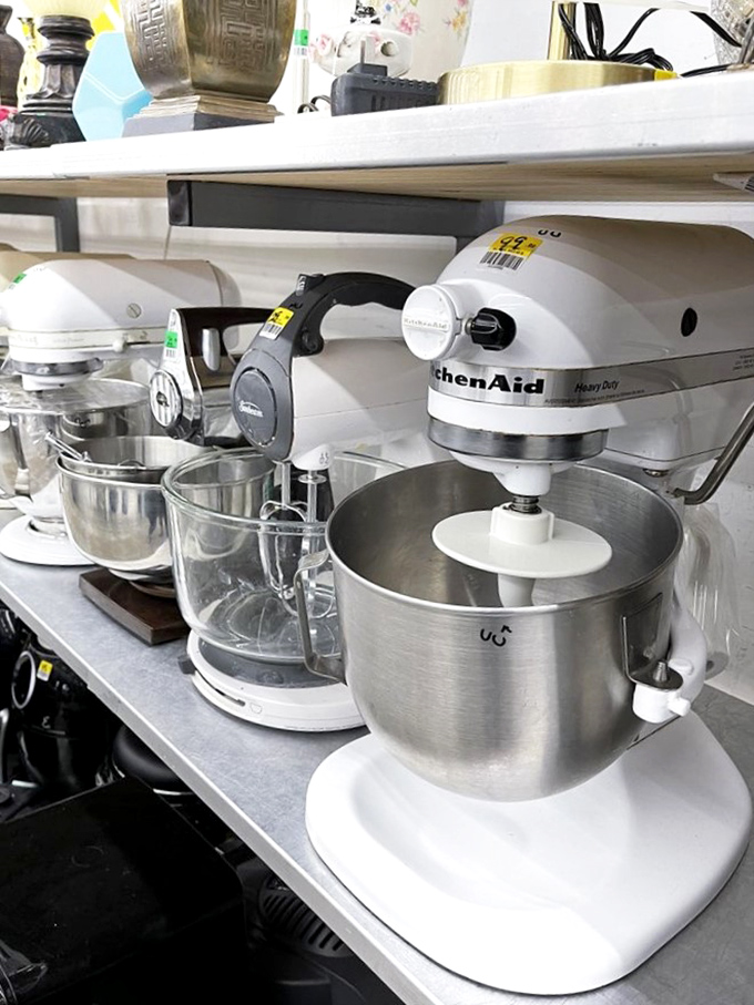 KitchenAid mixers lined up like culinary soldiers, ready to whip up new memories in your kitchen for a fraction of their original price.