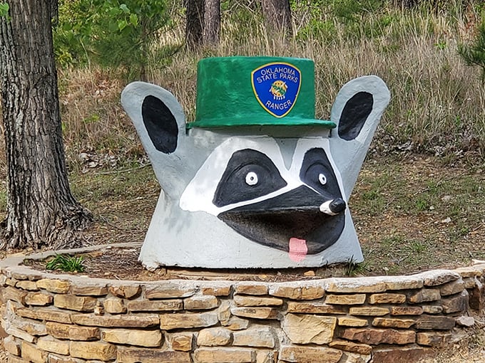 Oklahoma's unofficial park mascot stands guard. This raccoon ranger might not give directions, but he'll definitely make the kids smile.