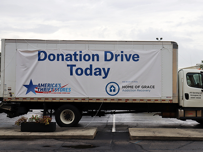 The donation truck announces its charitable partnerships, reminding shoppers their purchases support meaningful community work.