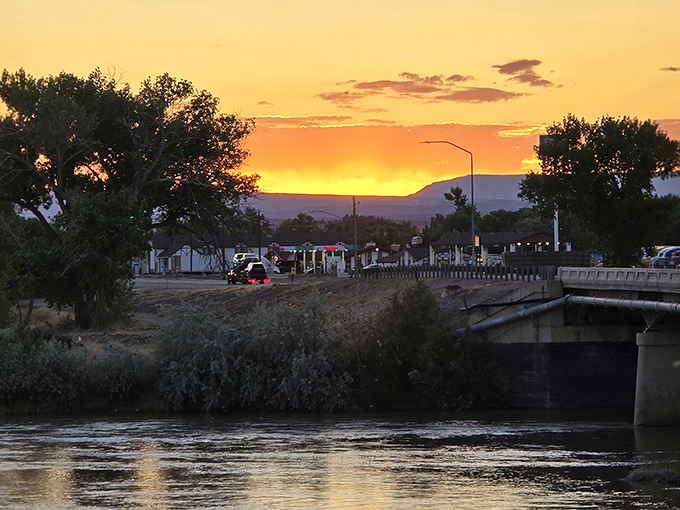 As the sun sets over Green River, the town's namesake waterway glows golden, promising another day of perfect melon-growing weather tomorrow.