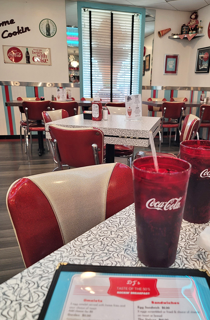 Red and cream chairs invite you to stay awhile. The Coca-Cola tastes better here&mdash;something about those neon lights makes everything sweeter.