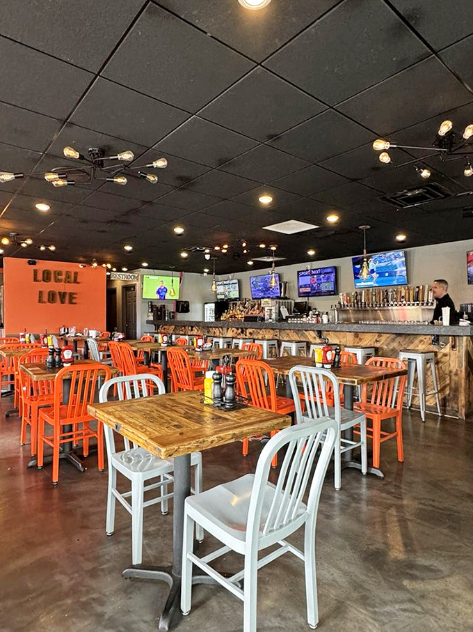 Bright orange chairs against rustic wood tables create that perfect "we're serious about food but not stuffy about it" vibe that keeps regulars coming back.
