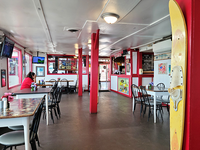 Red pillars stand like exclamation points in a dining room that says "casual" without shouting it. This is where memories are made between bites of seafood.