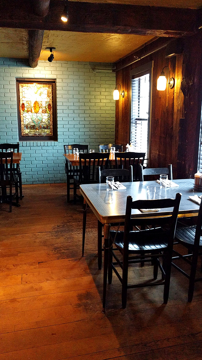 Blue walls, wooden accents, and stained glass create Bluebird's distinctive dining room. Simple tables invite you to focus on what matters: the food.