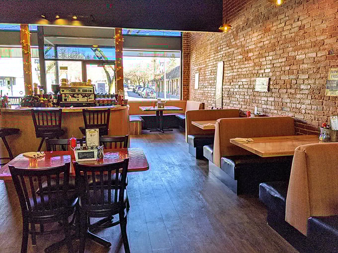 Exposed brick walls and wooden tables create the perfect canvas for breakfast masterpieces. Simplicity that lets the food be the star.