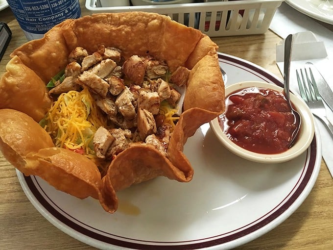 A crispy tortilla bowl cradles seasoned chicken and colorful toppings. When North Carolina meets Mexico, everybody wins&mdash;especially your taste buds.