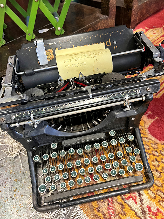 An Underwood typewriter still loaded with paper, frozen mid-sentence like its owner just stepped away for coffee seventy years ago.