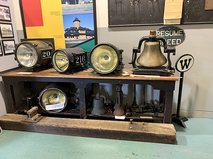 These vintage railroad lanterns and bells once guided trains safely through the darkness, their brass surfaces glowing with history.