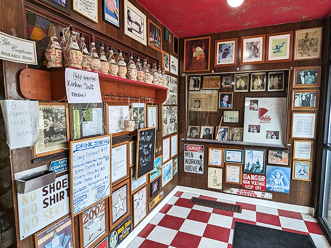 The wall of memories tells stories of decades of diners, celebrations, and the occasional "No Shirt, No Shoes, No Pizza" warning.