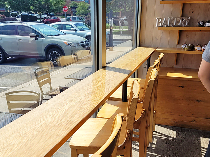 Window seating: where you can contemplate life's great mysteries while watching the outside world go by, doughnut in hand.