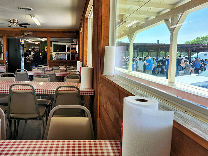 Through these windows, barbecue pilgrims can see the promised land &ndash; a line of devoted followers waiting for their smoky reward.