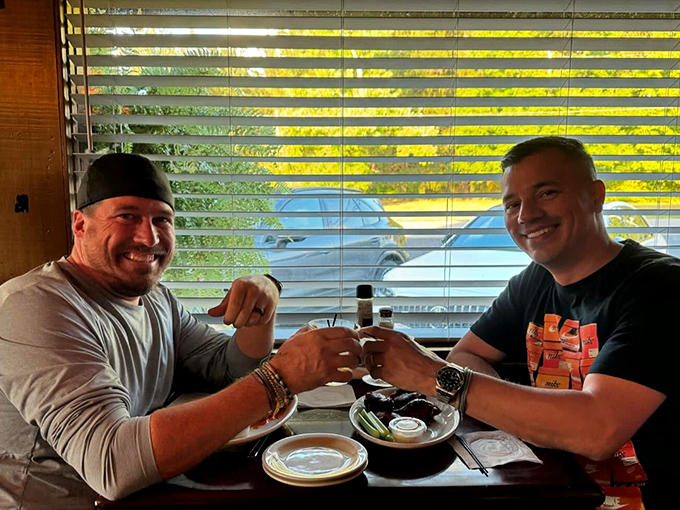 Window seats with blinds that filter sunshine like nature's Instagram filter - perfect for burger contemplation.