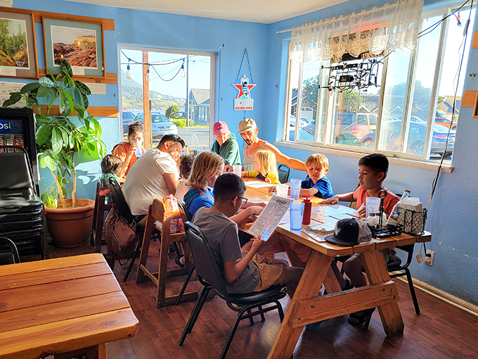 Large windows flood the blue interior with natural light, creating the perfect backdrop for seafood that deserves to be seen as well as tasted.