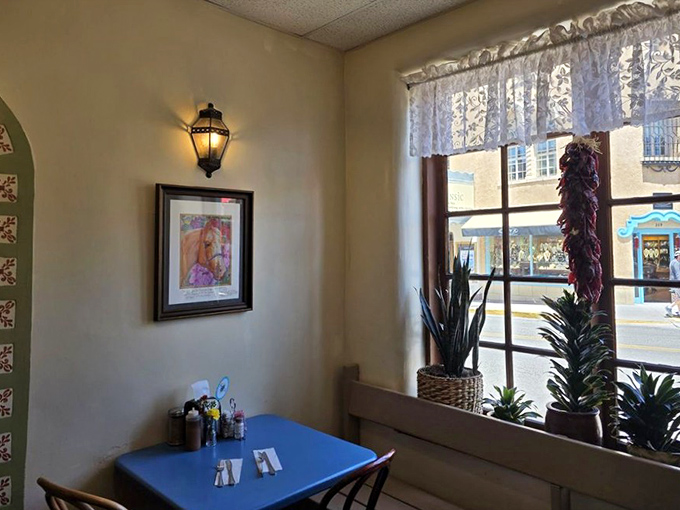 A quiet corner where Santa Fe sunshine streams in alongside the aroma of fresh tortillas. The chile ristra hanging in the window isn't just decoration&mdash;it's a promise. 