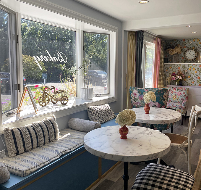 Window seating that combines comfort with people-watching potential—the holy grail of café experiences.