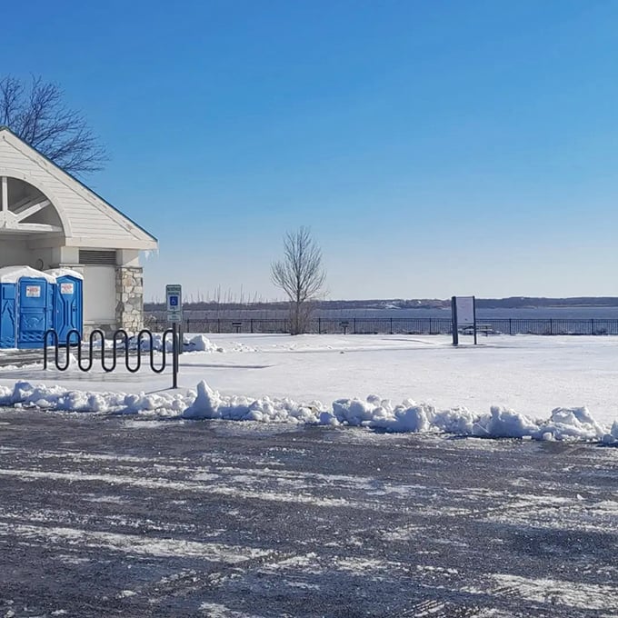 Winter transforms Fox Point into a serene snow globe scene. The portable toilets remain heroically available&mdash;true dedication to visitor comfort in all seasons.