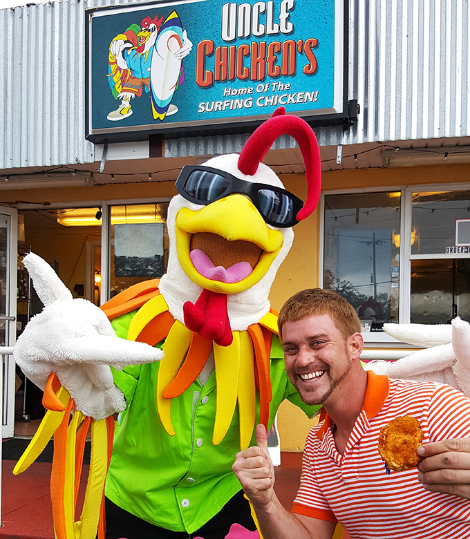 The surfing chicken mascot welcomes happy diners with open wings. When your restaurant mascot has more personality than most reality TV stars.