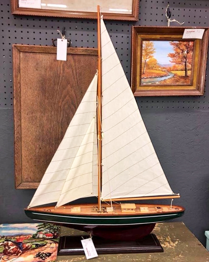 A model sailboat that belongs in a Cape Cod cottage, ready to inspire nautical dreams in your home.