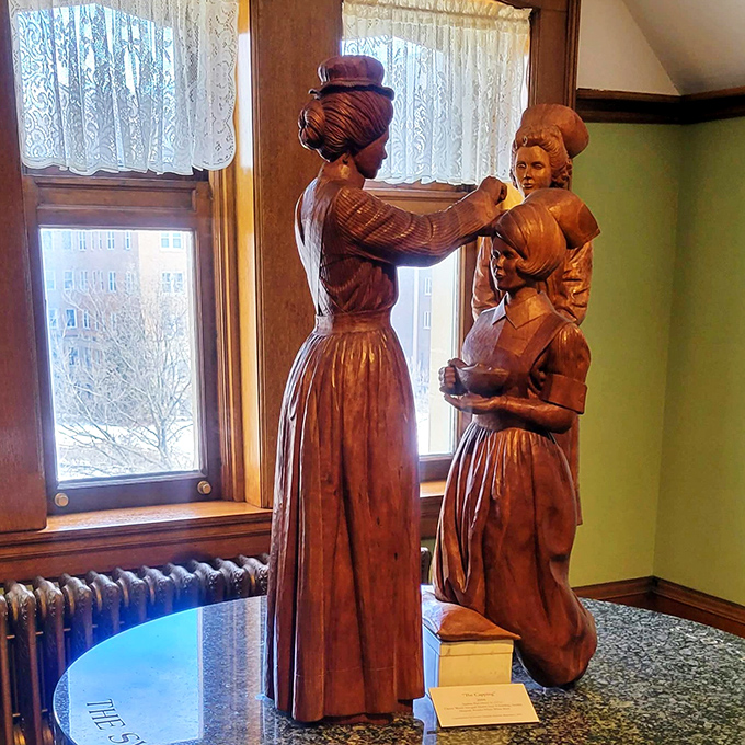 These wooden figures stand in quiet conversation by the window, their carved expressions capturing the essence of traditional Swedish craftsmanship and storytelling.