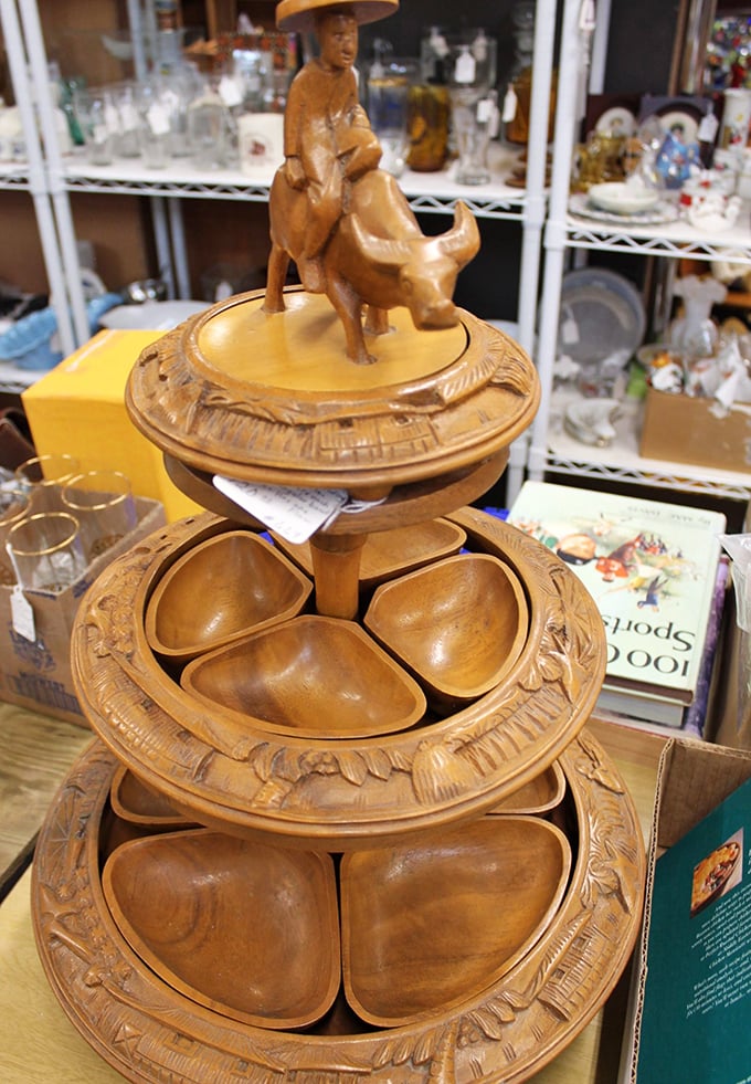 A three-tiered wooden serving masterpiece topped with what appears to be a cowboy riding... something. Sunday entertaining will never be the same.