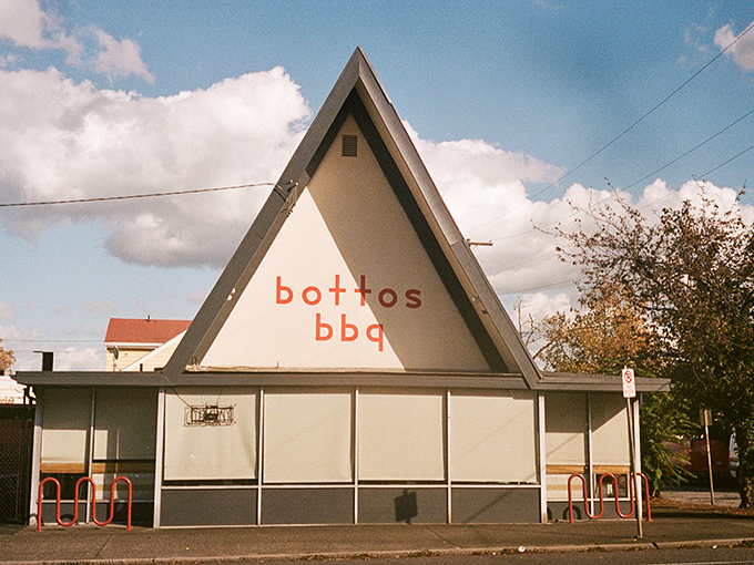 Botto's A-frame architecture stands out like a mid-century modern barbecue dream. Minimalist outside, maximalist flavors inside.