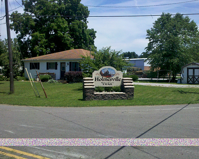 "Welcome to Holmesville" &ndash; one of Holmes County's hidden gems. This unassuming sign marks entry to authentic Amish Country.