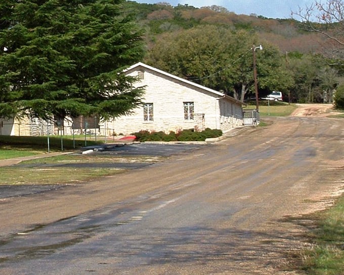 Simple building nestles into hillsides where summer camps have created memories for generations of happy children yearly.