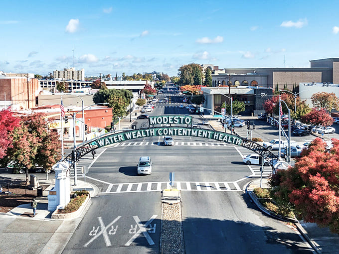 Modesto's famous arch spans the street with words of wisdom that have greeted visitors for generations: "Water Wealth Contentment Health."