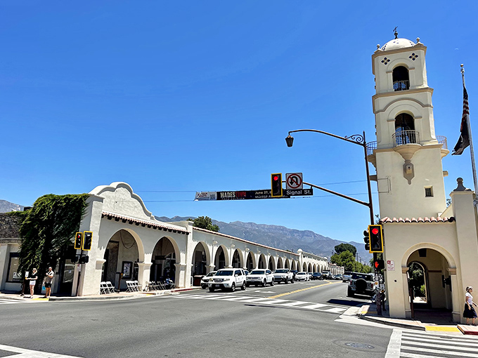 Ojai's Spanish colonial architecture stands proudly against a perfect blue sky, where bell towers and arcades create a Mediterranean mirage in Southern California.