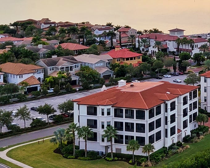 Safety Harbor's terracotta rooftops glow at sunset, showing a waterfront community that values peace and beauty over hustle and crowds.