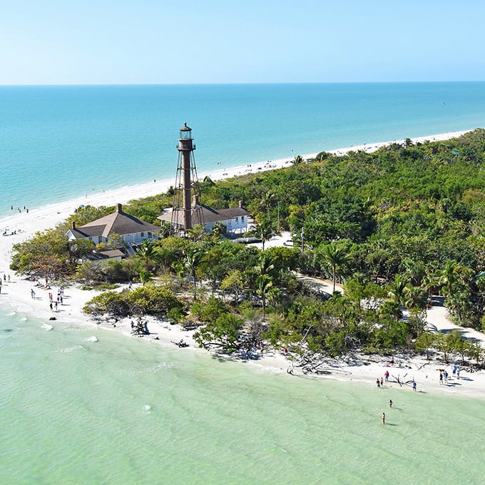 Sanibel's lighthouse stands as a sentinel against time and tide, witnessing countless sunrises over waters teeming with shells.