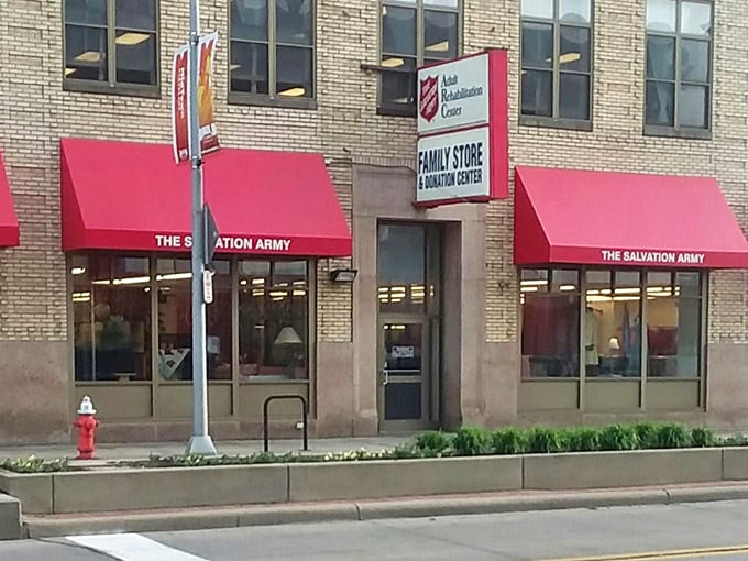 Classic Salvation Army red awnings have been promising community help and great bargains for generations.