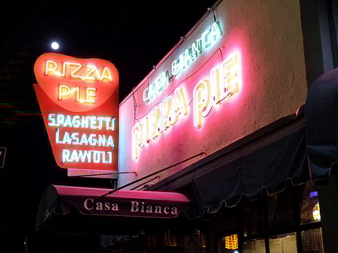 The vintage glow of Casa Bianca's neon signage transforms an ordinary night into a timeless Los Angeles pizza pilgrimage.