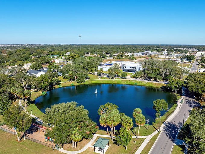 The central park in Davenport provides a gathering place for community events, with its serene pond reflecting Florida's blue skies.
