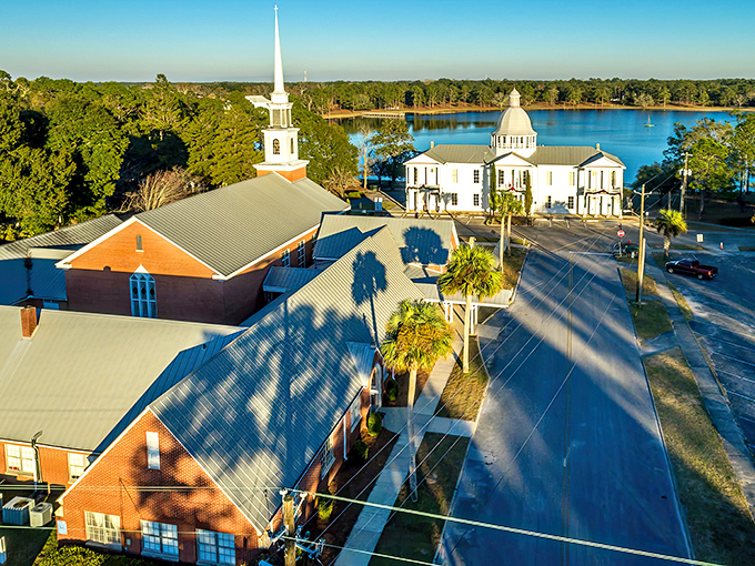 The churches of DeFuniak Springs stand tall against the Florida sky. This historic town center looks straight out of a Norman Rockwell painting.