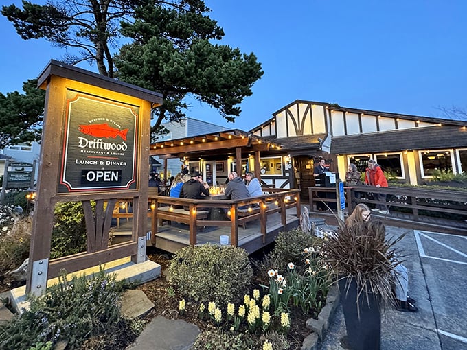 Evening lights transform Driftwood's patio into a magical dining experience. Decades of seafood perfection in a picture-perfect setting.