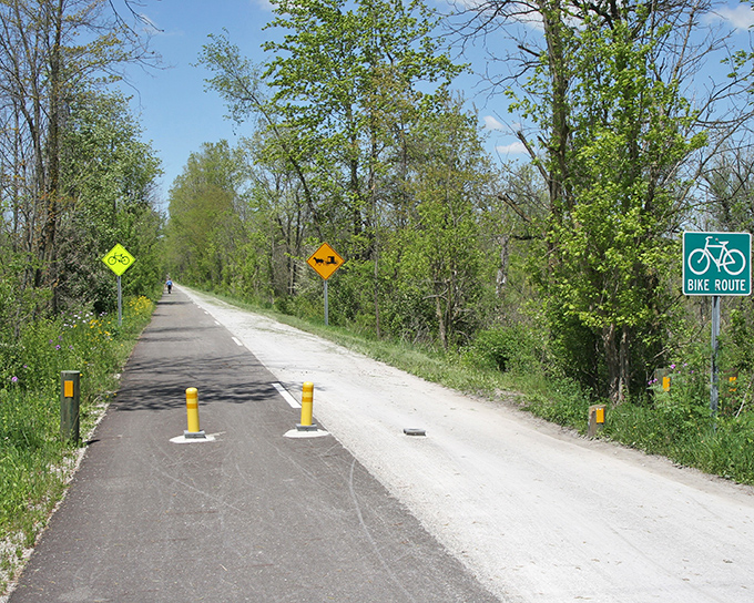 The Holmes County Trail welcomes cyclists and buggies alike. This former railroad path connects Amish communities through beautiful countryside.