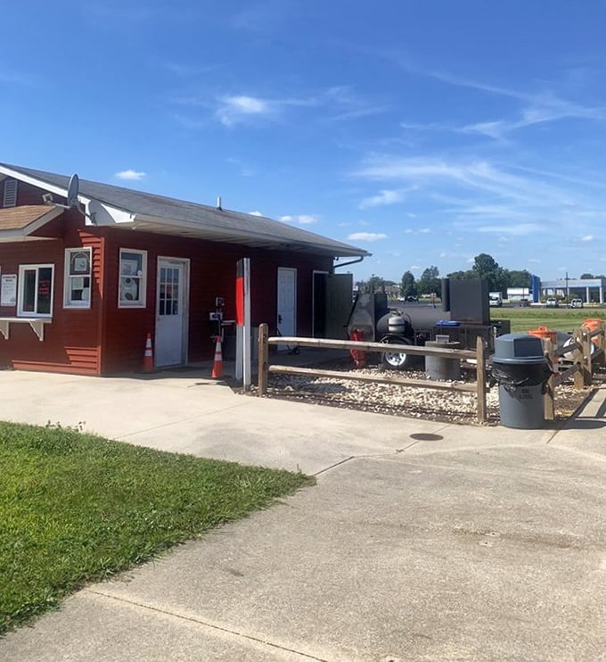 Small red building, big barbecue dreams - sometimes the best smoky treasures come in humble packages.