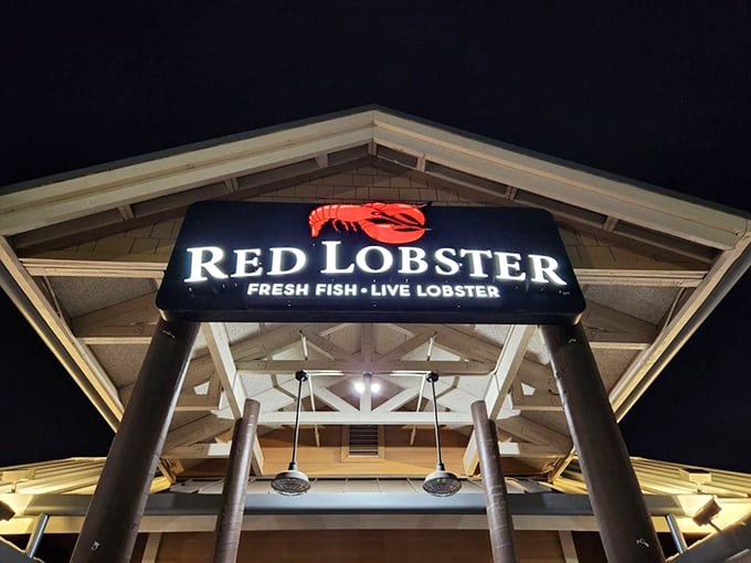 The iconic sign glows against the night sky, promising seafood classics done right. Red Lobster's consistent quality makes it a reliable choice for family celebrations.