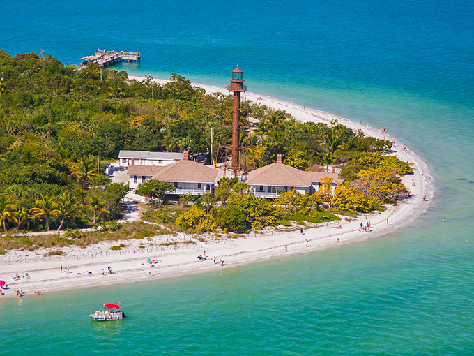 The aerial view of Sanibel shows a perfect crescent of beach where shell collectors perform the "Sanibel Stoop" like a synchronized dance.